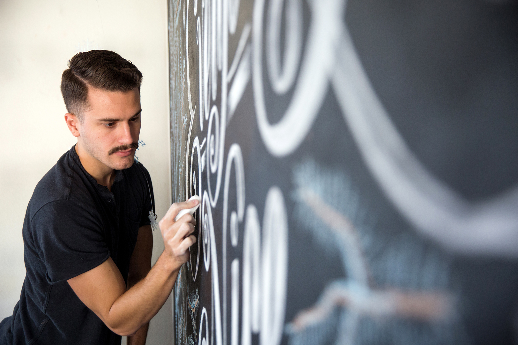 Graphic designer’s skill with lettering seen all over town - [225]